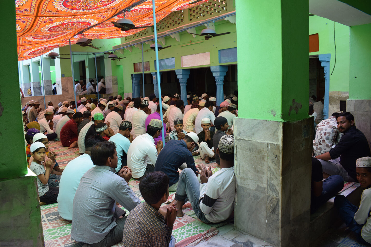 How does India's Sadhan village continue to resist religious polarization?