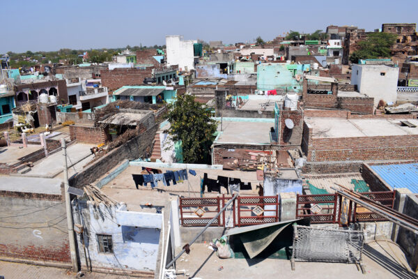 How does India's Sadhan village continue to resist religious polarization?